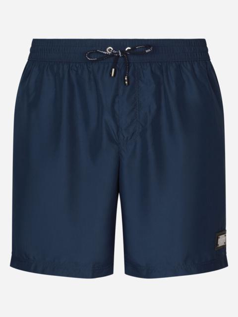 Dolce & Gabbana Long-leg swim trunks with branded tag | REVERSIBLE