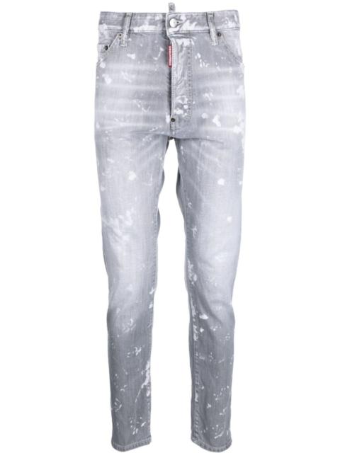 DSQUARED2 paint-splatter tapered jeans | REVERSIBLE