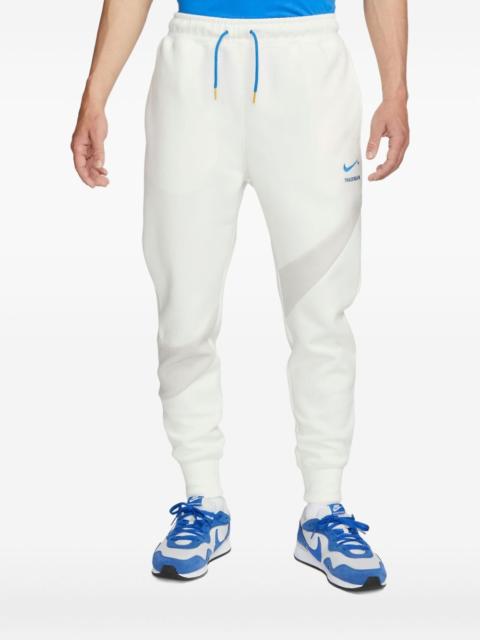 Nike Swoosh tech track pants | REVERSIBLE