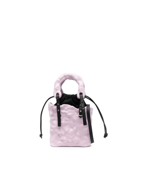 OTTOLINGER logo-embossed bucket bag | REVERSIBLE