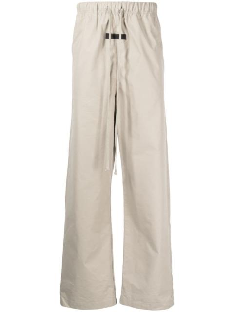 ESSENTIALS logo-patch straight-leg trousers | REVERSIBLE