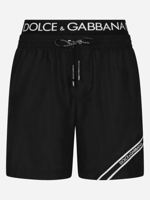 Dolce & Gabbana Mid-length swim trunks with branded band | REVERSIBLE